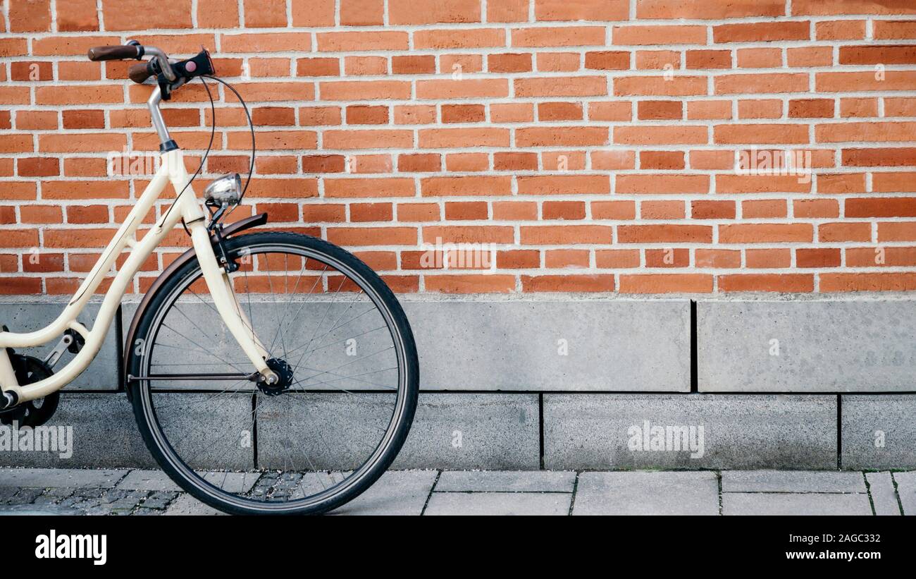 Vintage bicycle on the brick wall background, 16:9 panoramic format ...