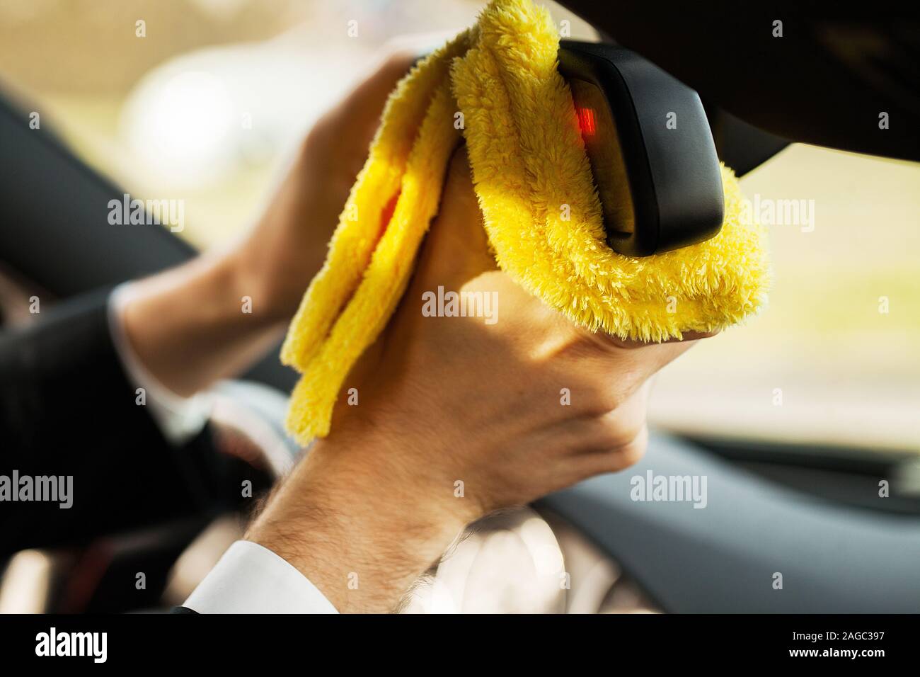 Cleaning car. Hand with microfiber cloth cleaning car interior Stock ...