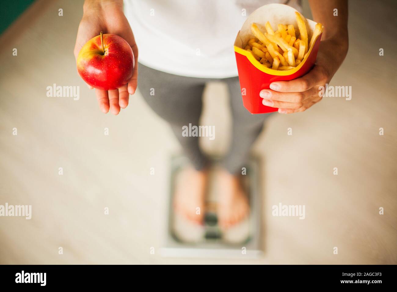 Diet. Woman Measuring Body Weight On Weighing Scale Holding Unhealthy ...