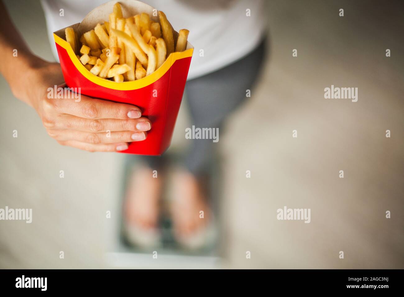 Diet. Woman Measuring Body Weight On Weighing Scale Holding Unhealthy ...