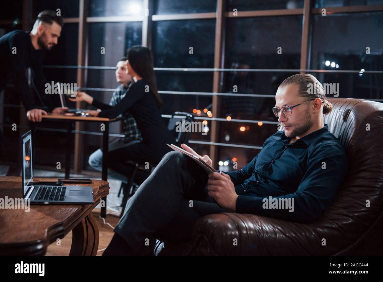 Working for himself. Team of young business people have job on their ...