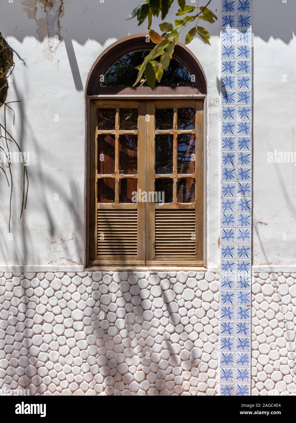 Old wooden window with tile wall and pebbles, Paqueta Island, Rio de ...