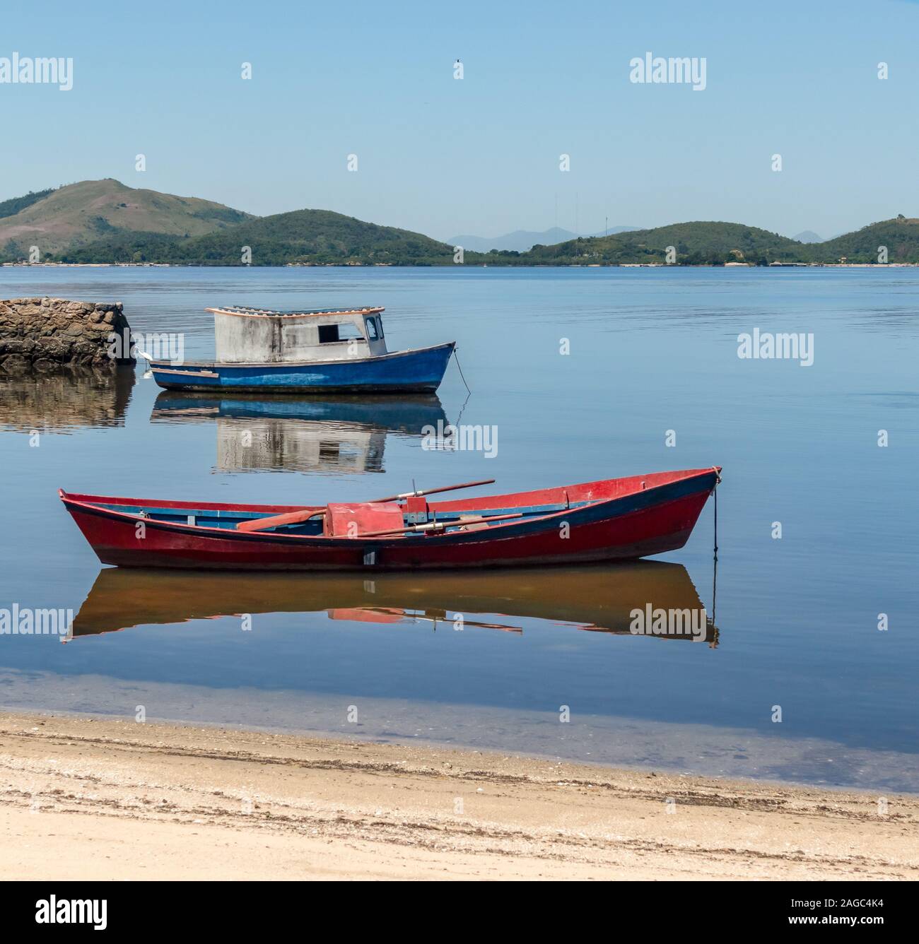 Fishing boats standing in the calm waters of Guanabara Bay, Paqueta ...