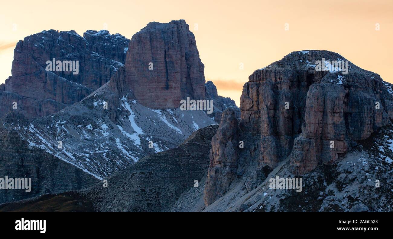Breathtaking shot of the rocks in the Italian Alps with the sunset sky ...