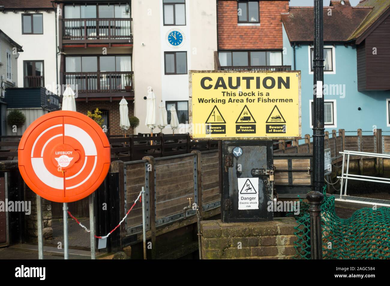 Notice warning Caution the dock is a working area for fishermen ...