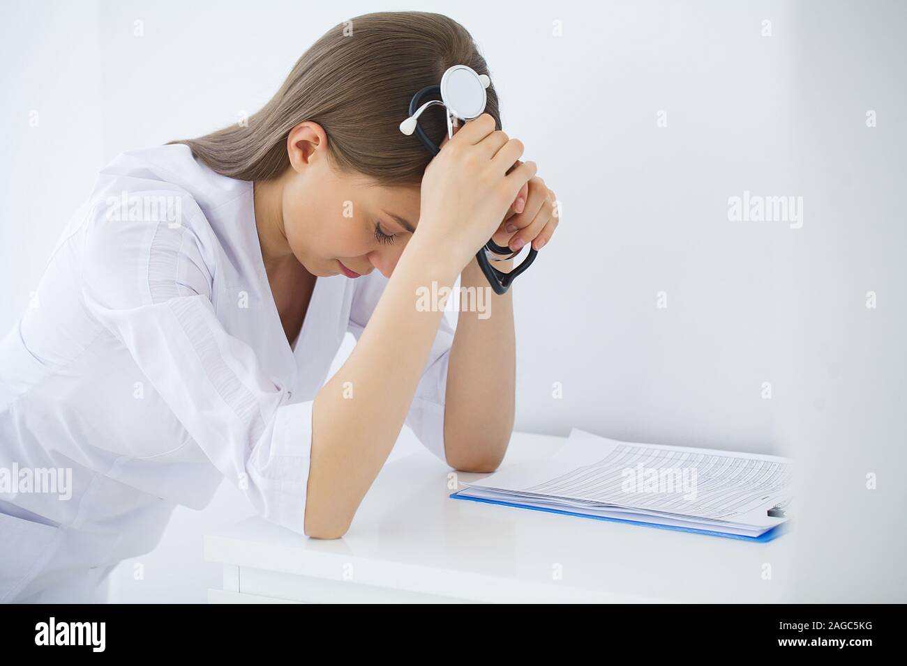 Doctor. Sad or crying female nurse at hospital office Stock Photo - Alamy