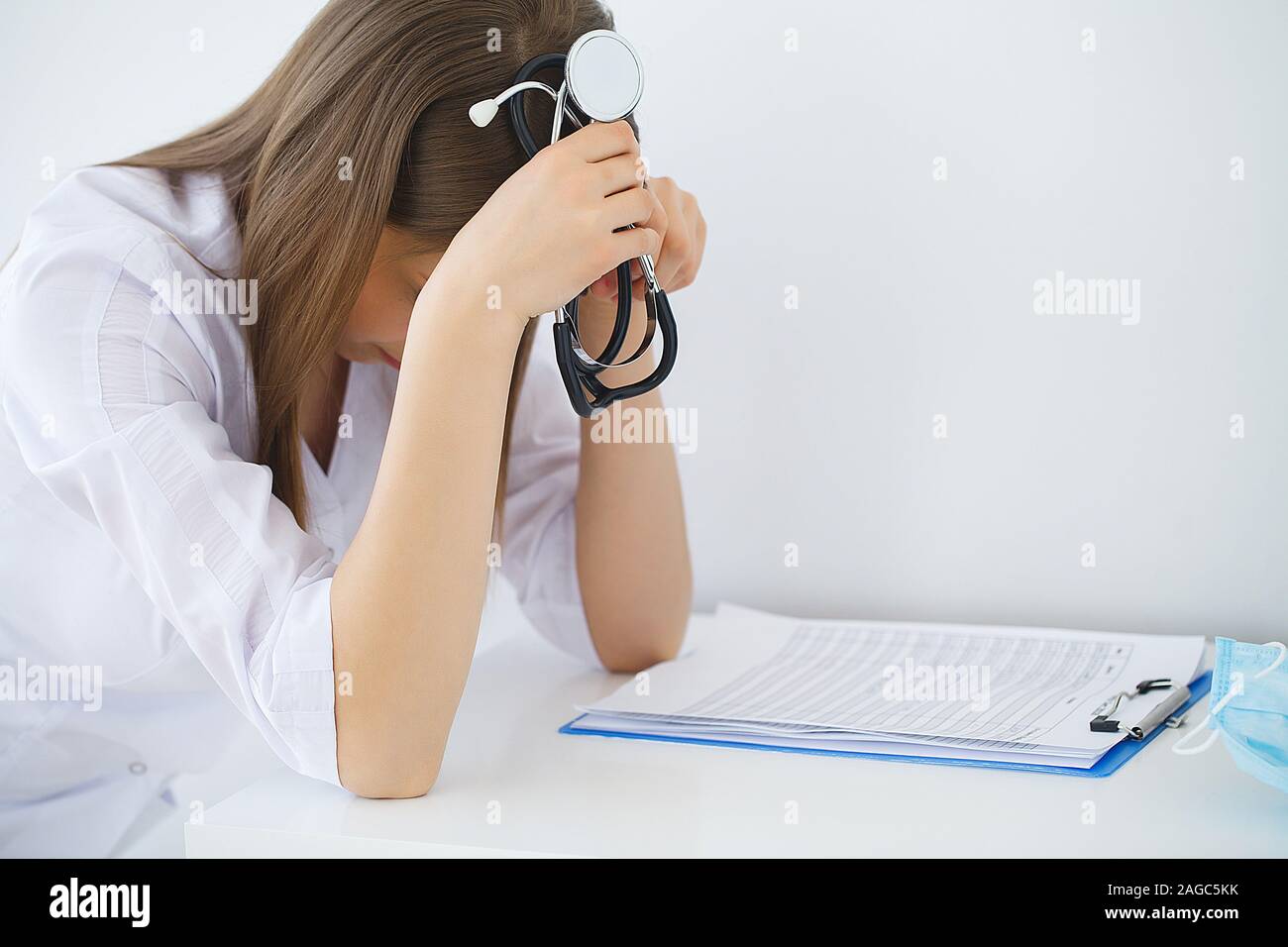 Doctor. Sad or crying female nurse at hospital office Stock Photo - Alamy