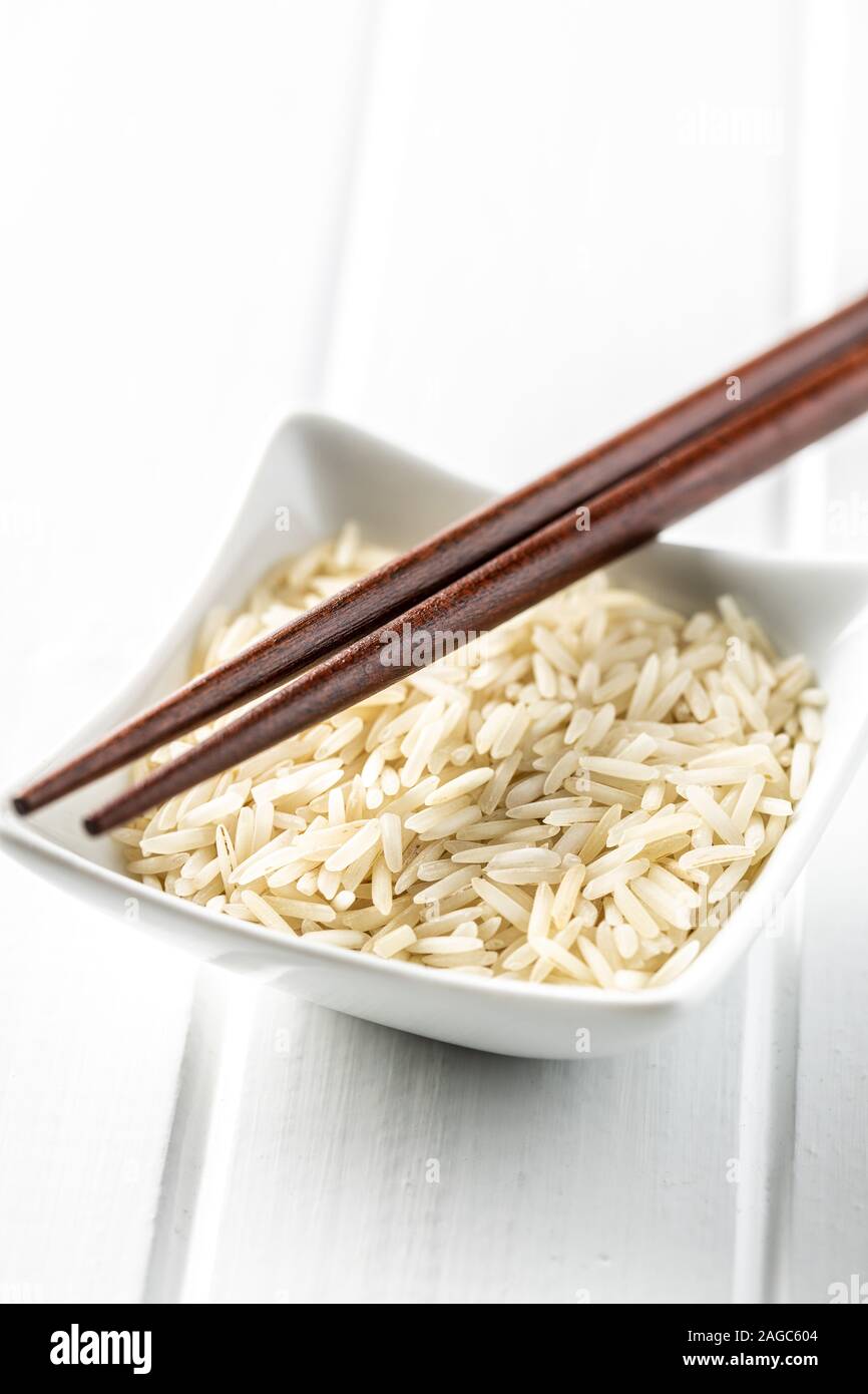 Uncooked rice with chopsticks hi-res stock photography and images - Alamy
