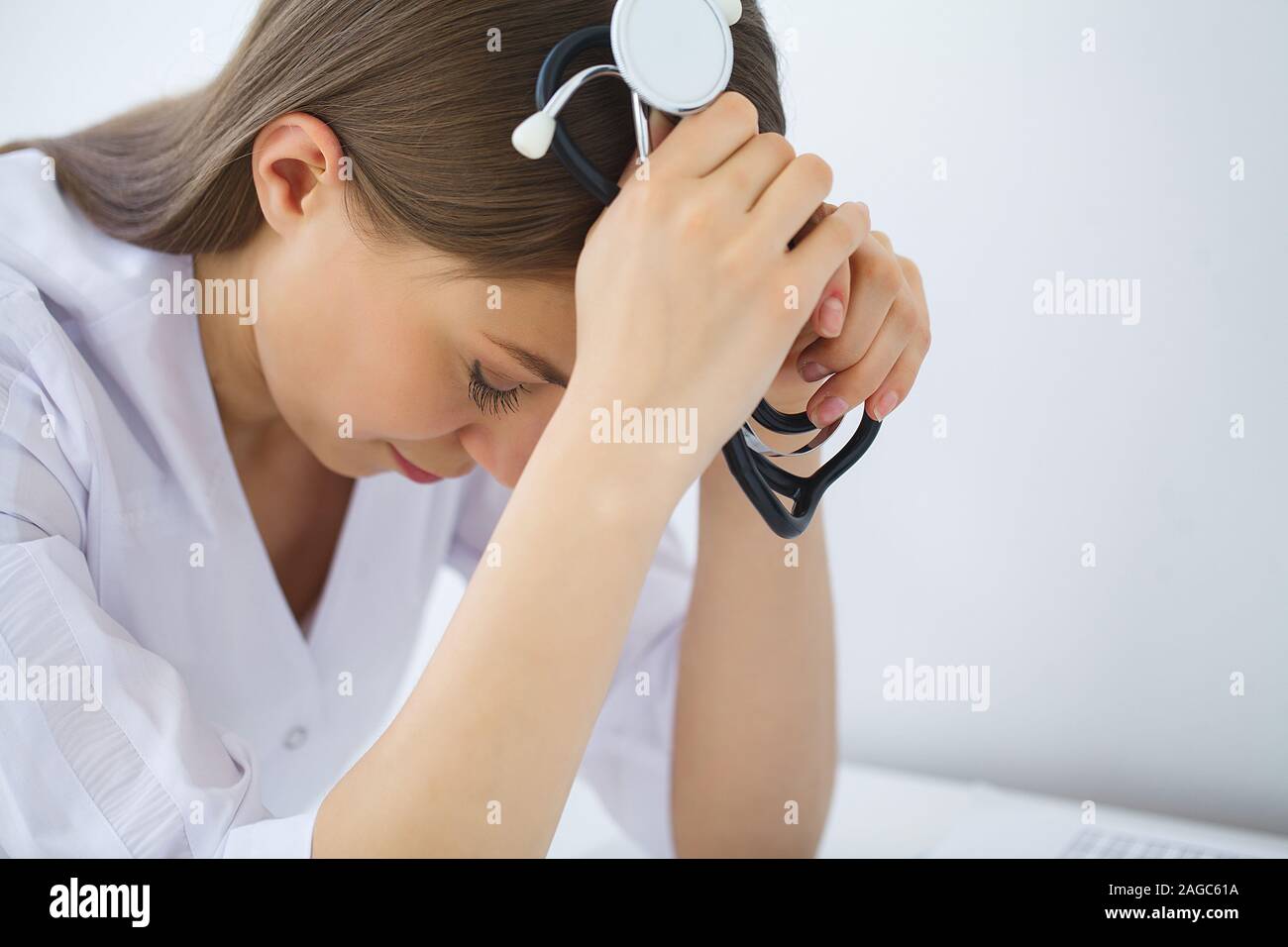 Doctor. Sad or crying female nurse at hospital office Stock Photo - Alamy