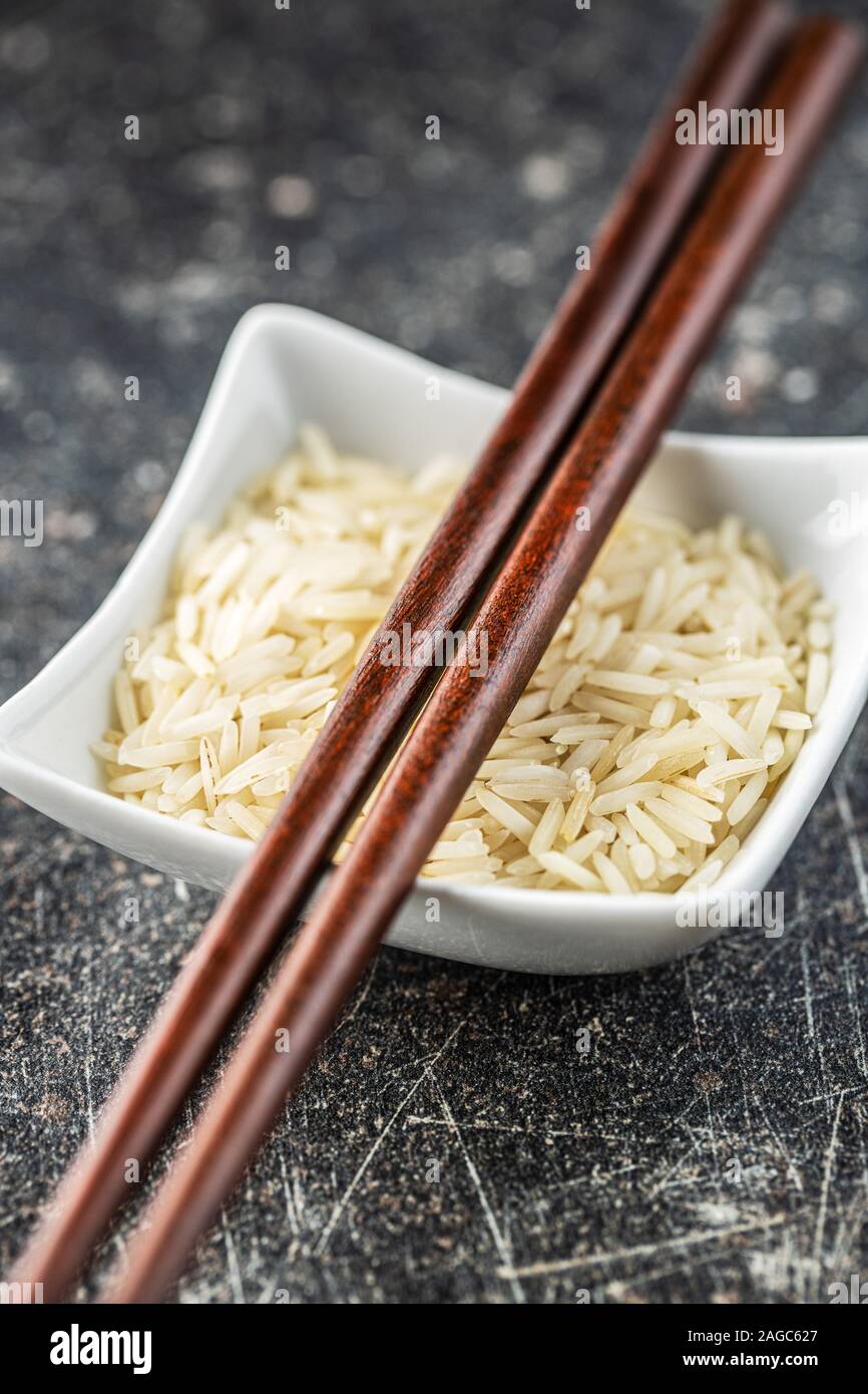 Uncooked rice with chopsticks hi-res stock photography and images - Alamy