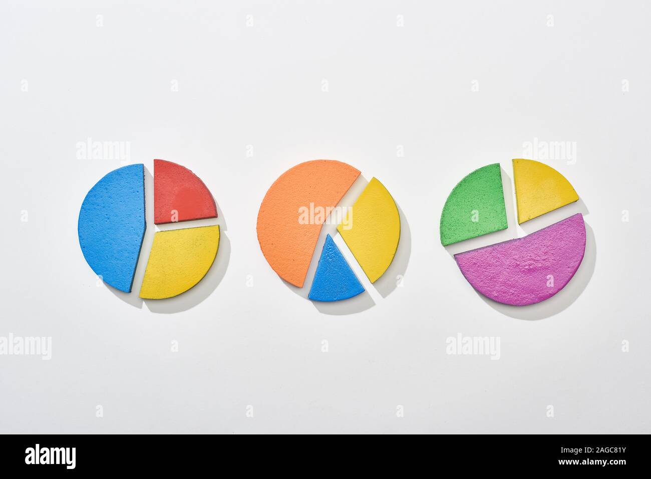 top view of multicolor pie charts on white background Stock Photo - Alamy