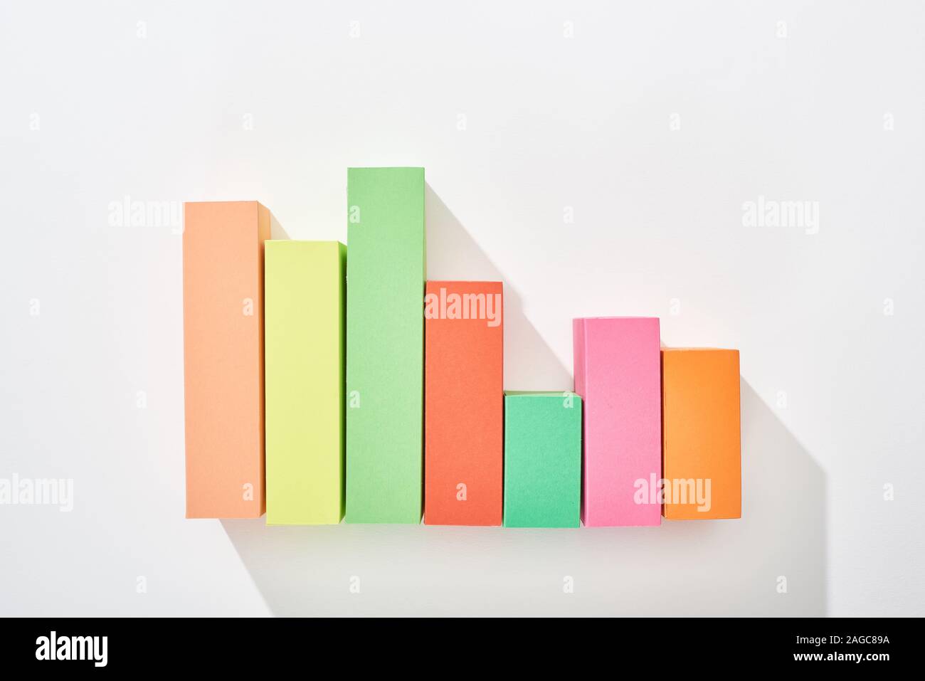 top view of multicolor analytical graph with shadow on white background ...