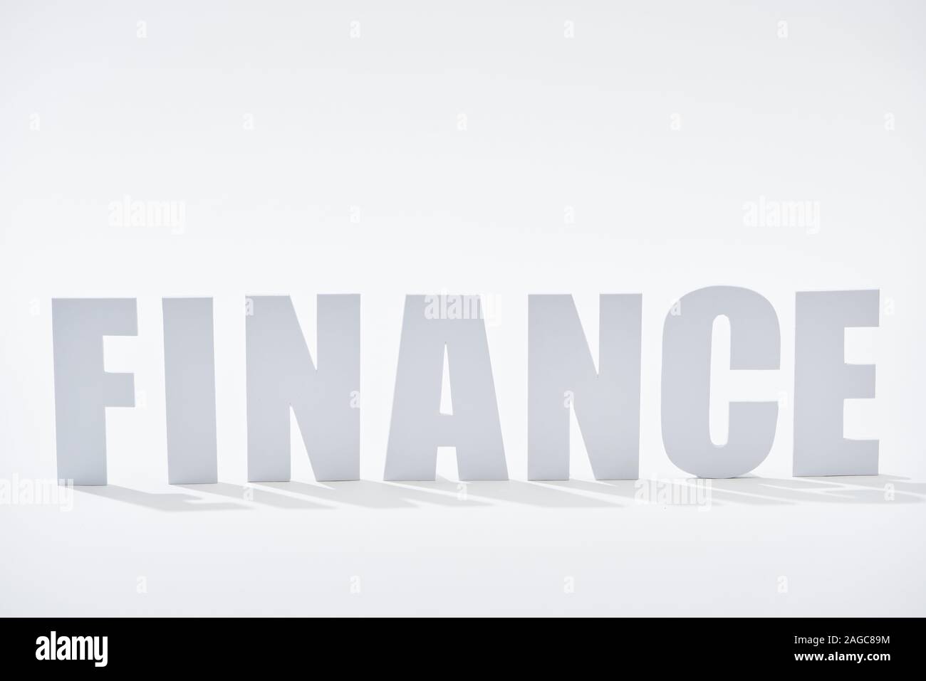 finance word with shadows on white background Stock Photo - Alamy