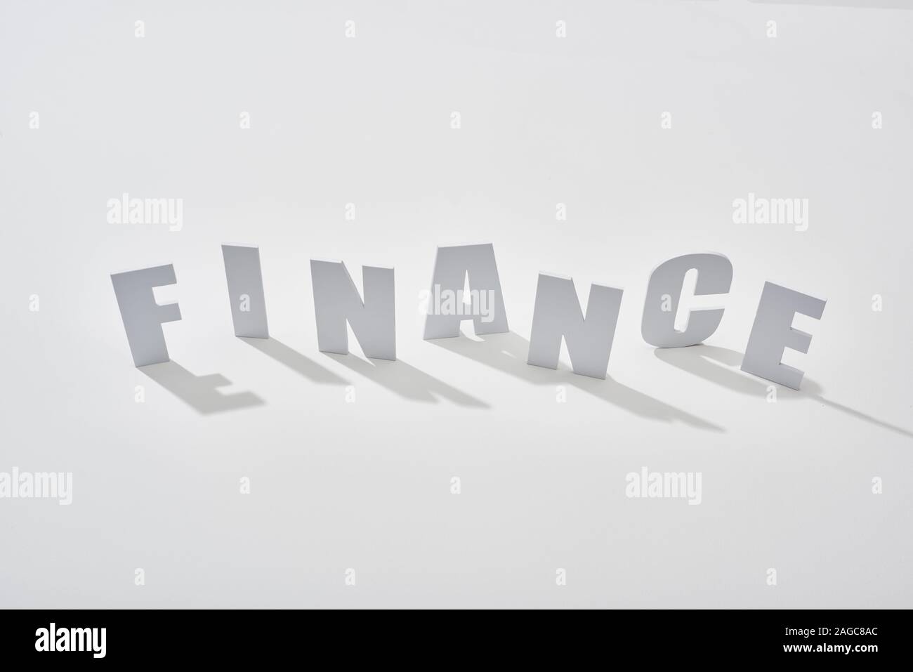 finance lettering with shadows on white background Stock Photo - Alamy