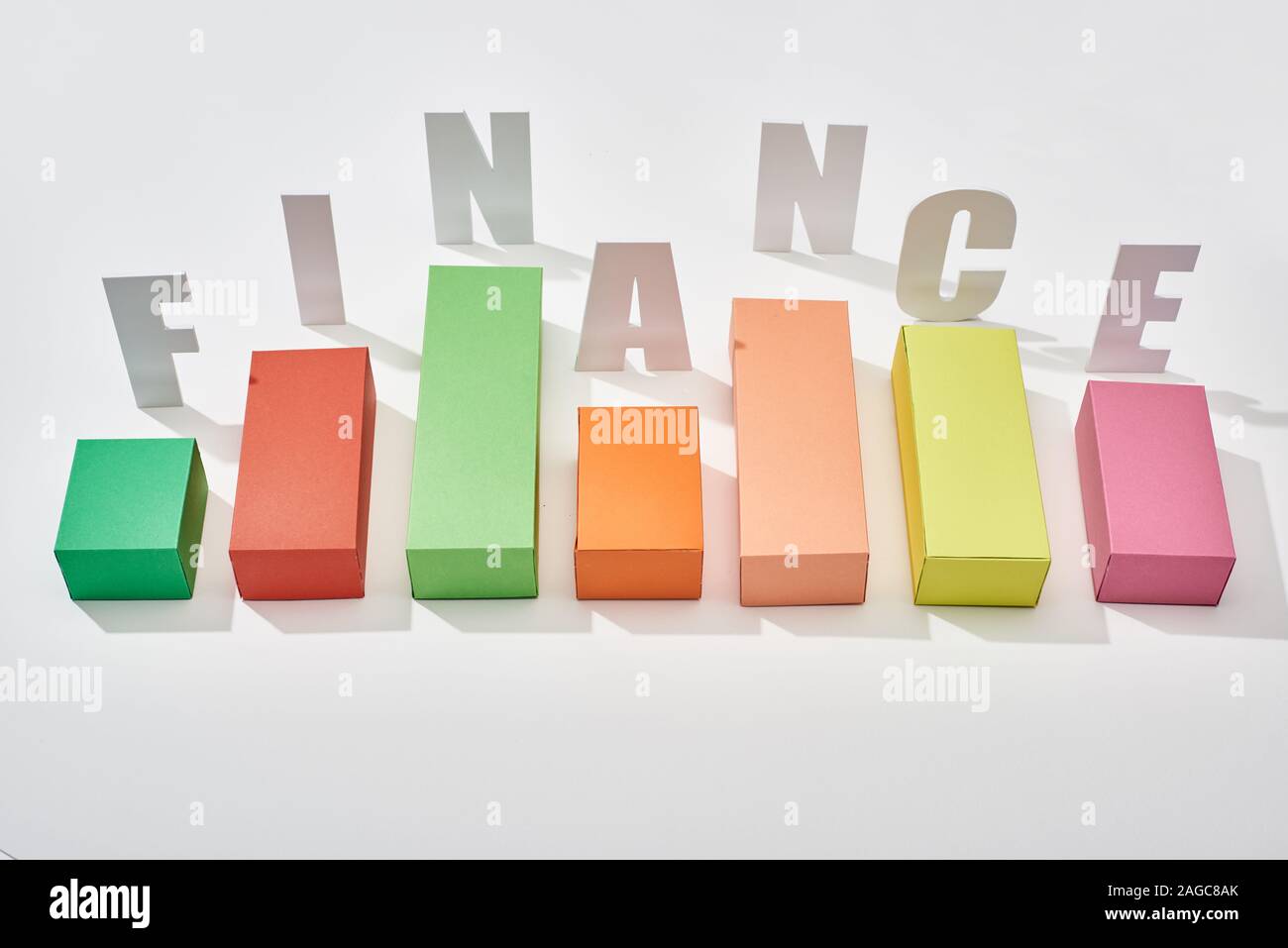 finance inscription near color block chart with shadow on white ...