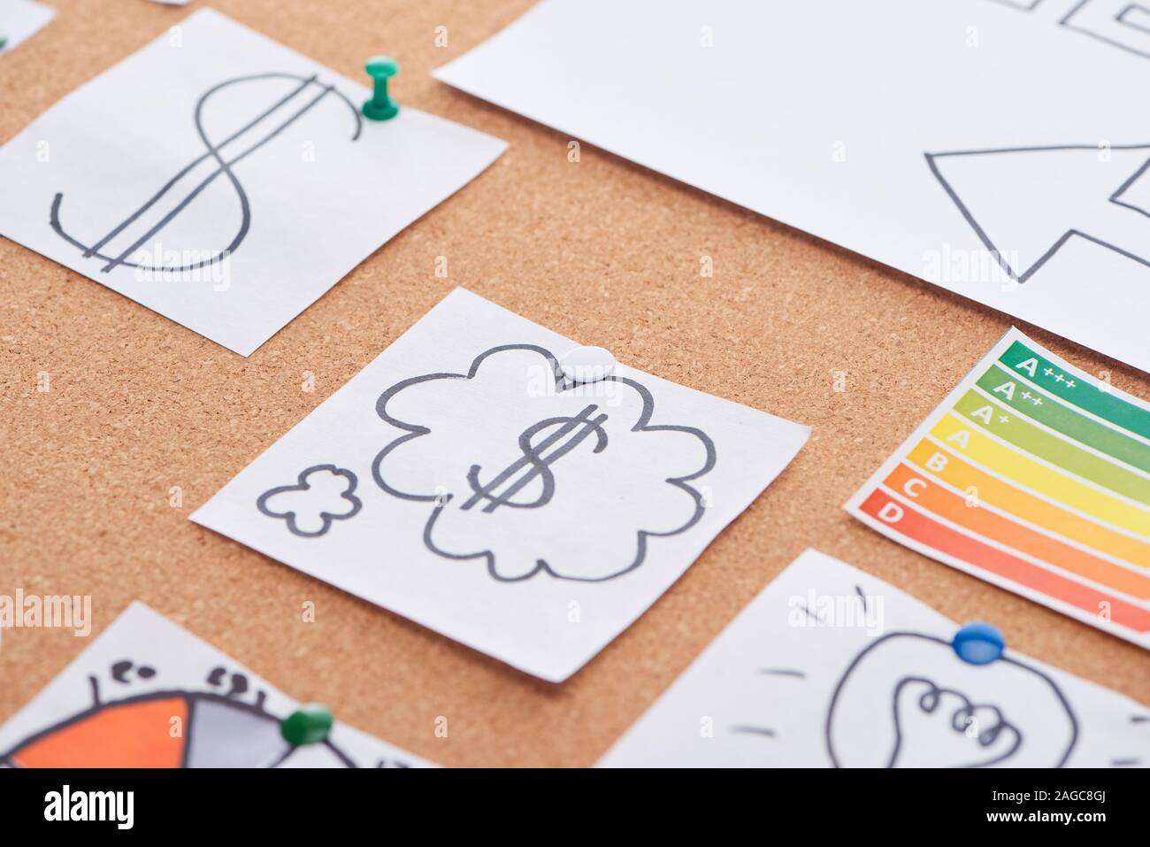 paper cards with dollar signs pinned on cork office board Stock Photo ...