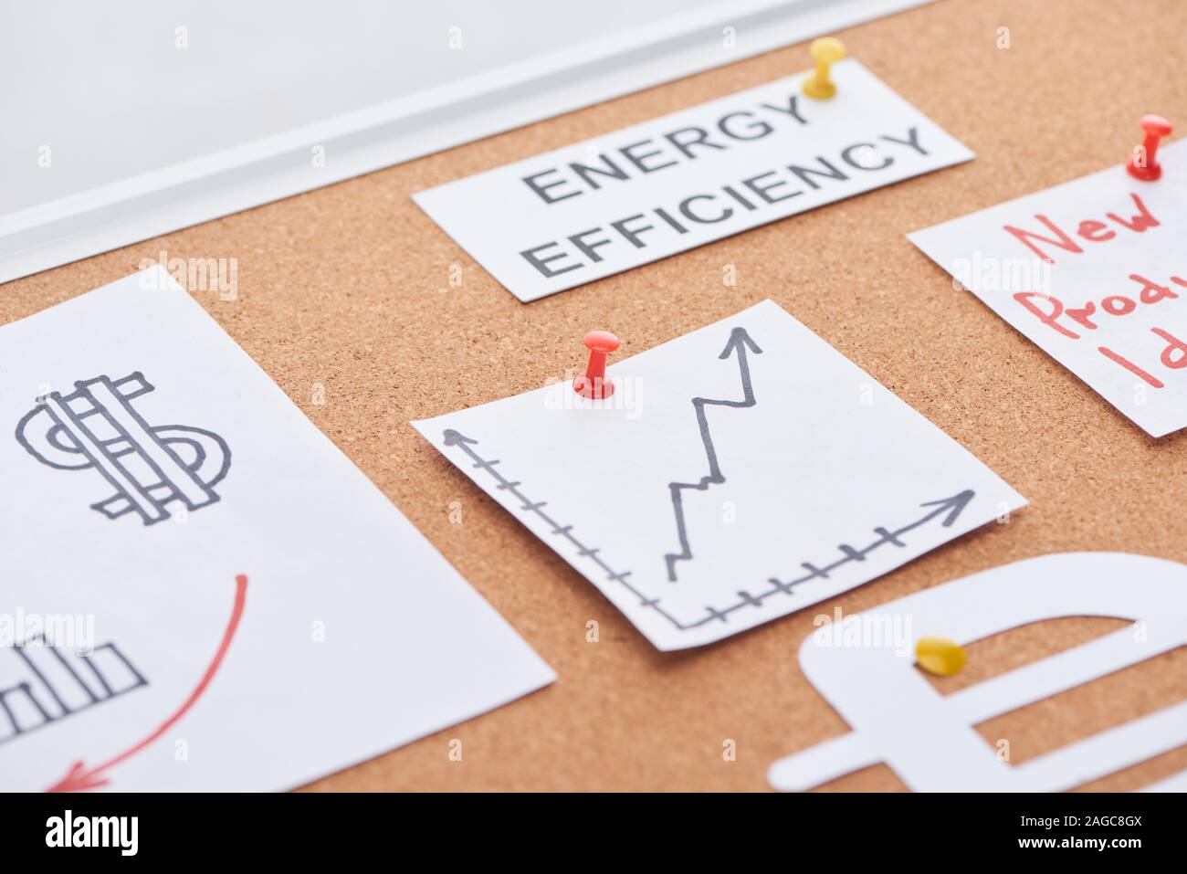paper cards with energy efficiency text and increase chart pinned on ...