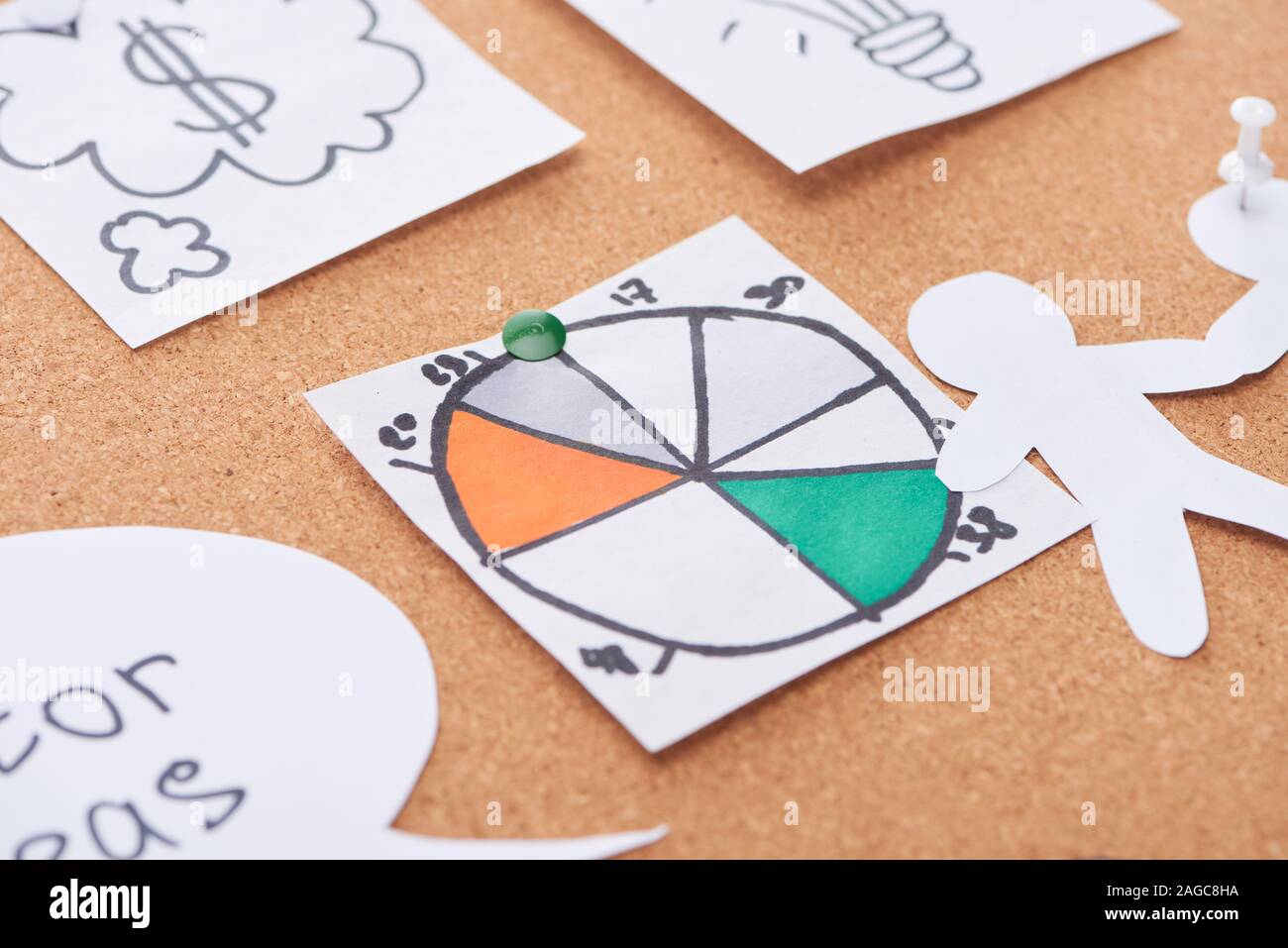paper card with colorful pie chart pinned on cork office board Stock ...