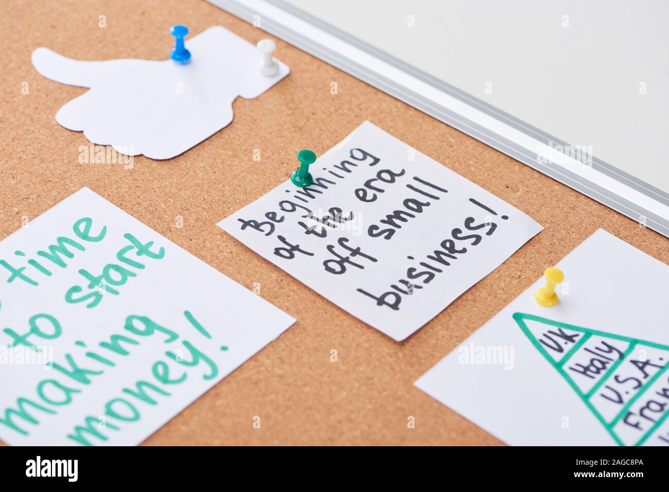 cards with work notes and like sign pinned on cork office board Stock ...