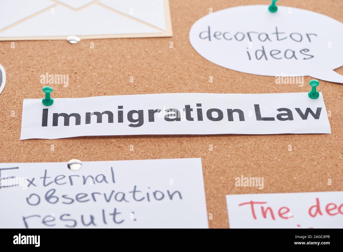 paper cards with decorator ideas and immigration law texts pinned on ...