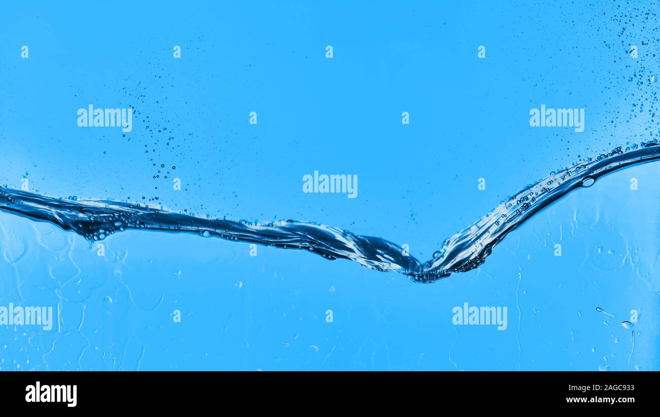 wavy water on blue background with droplets Stock Photo - Alamy