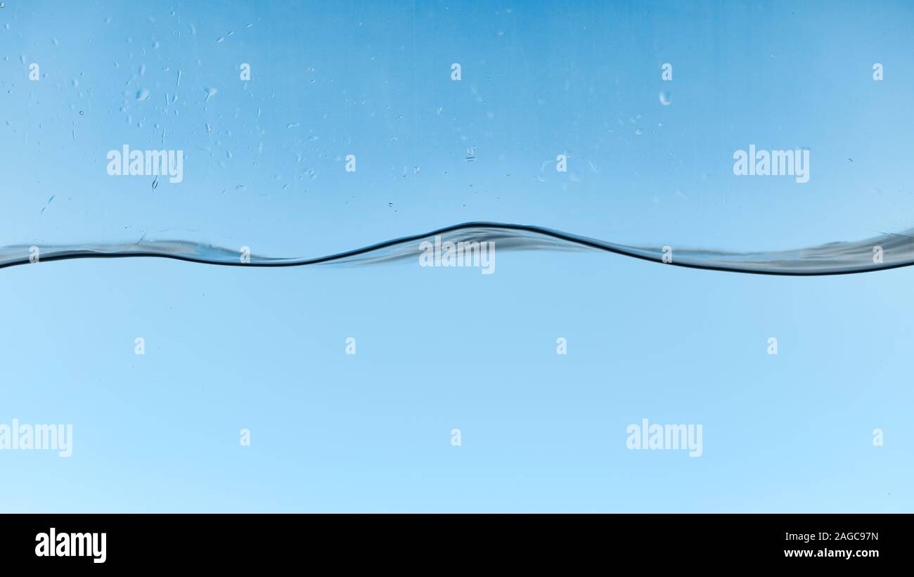 wavy water on blue background with droplets Stock Photo - Alamy
