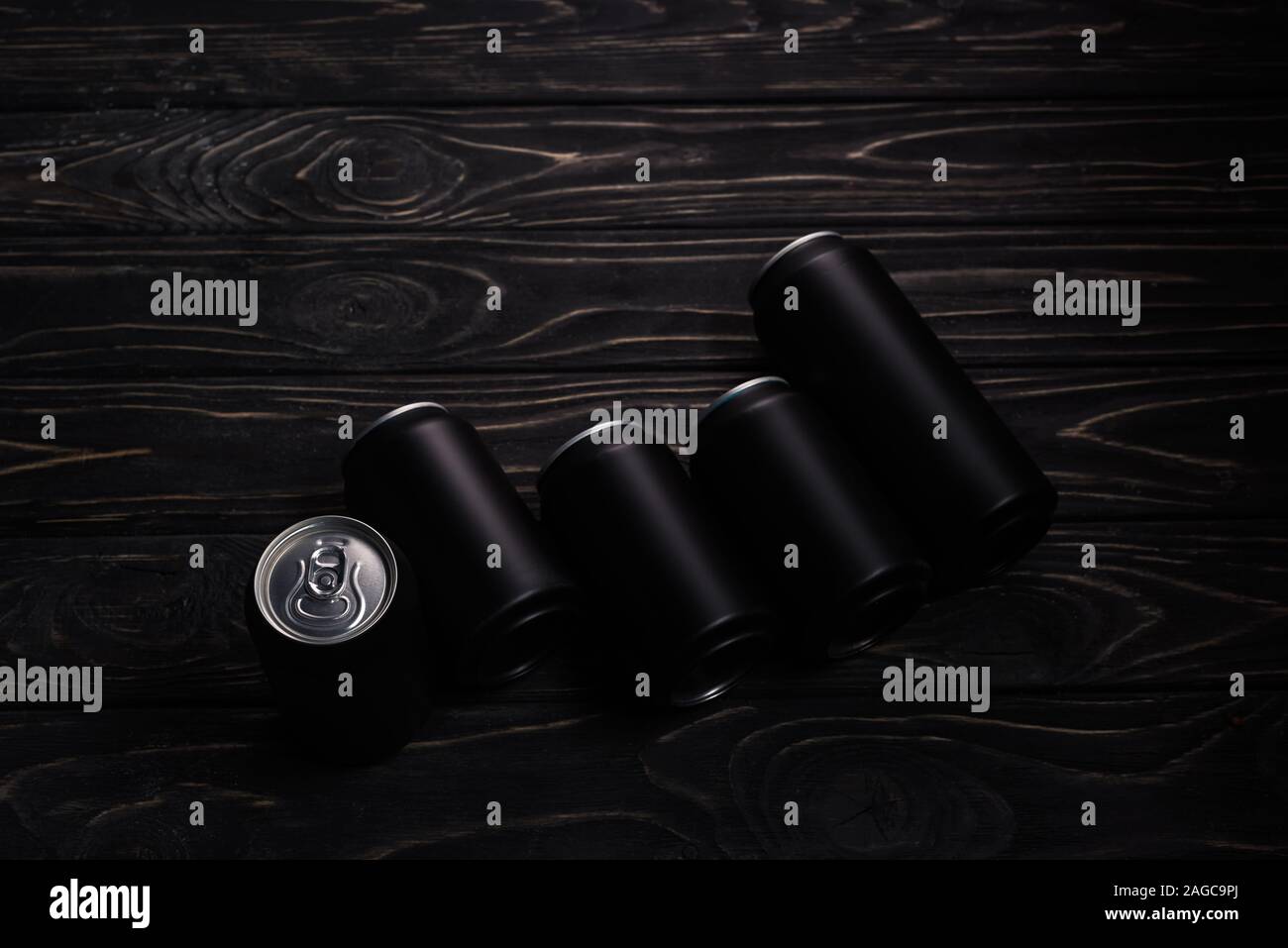 black aluminum cans of beer on wooden table with copy space Stock Photo ...