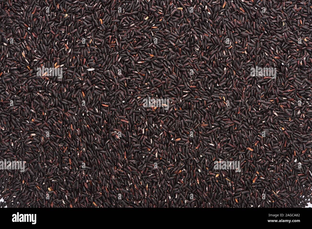 top view of raw organic black rice Stock Photo - Alamy