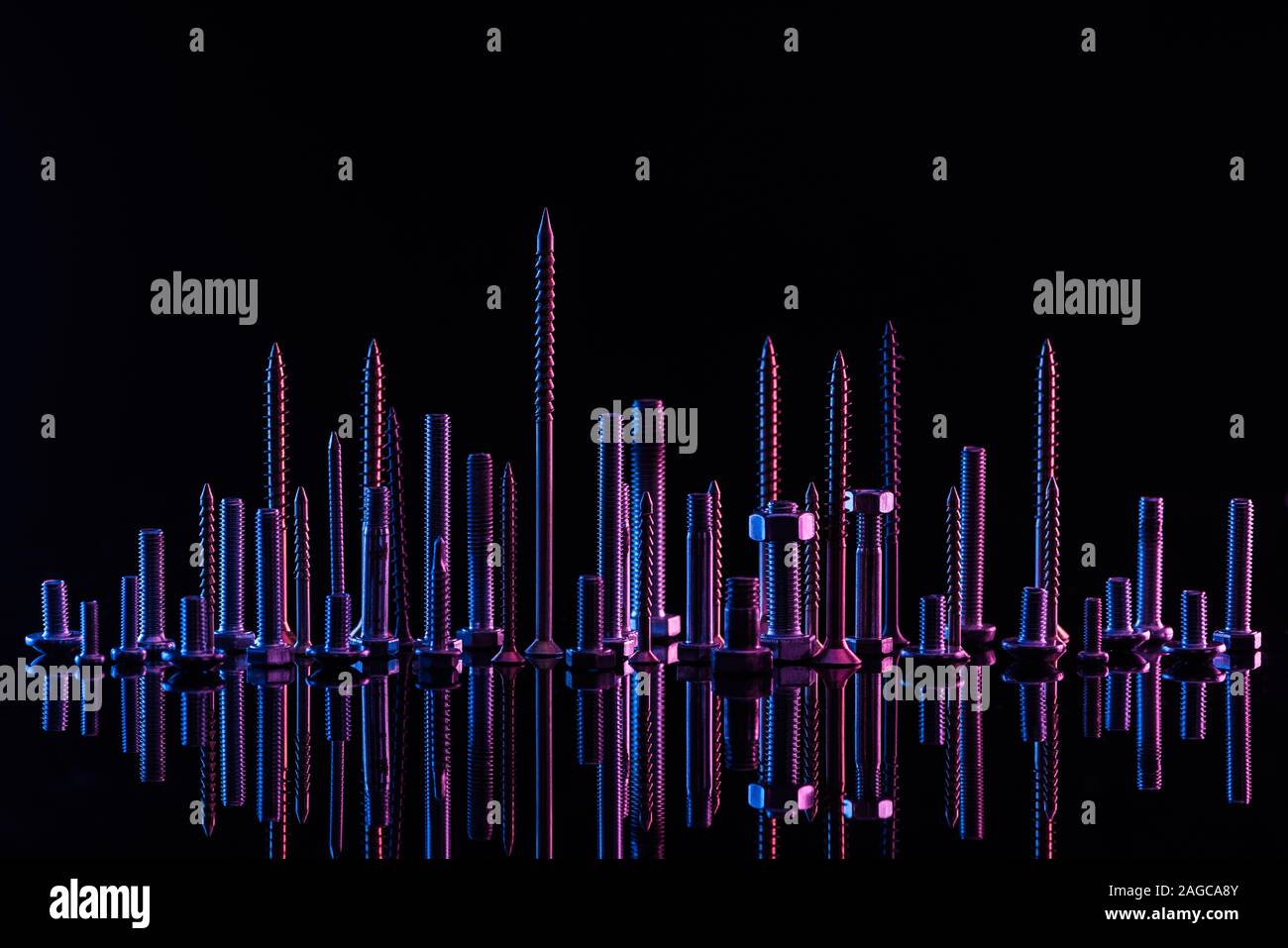 diverse purple metallic screws isolated on black Stock Photo - Alamy