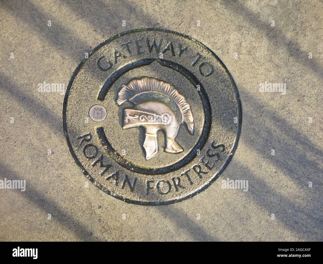 A floor plaque in the city walls marks a heritage Roman site in York ...