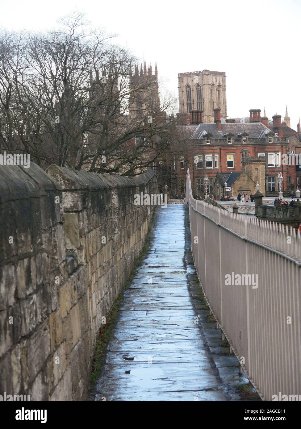 Walking north-east along a section of the city walls at York, with the ...