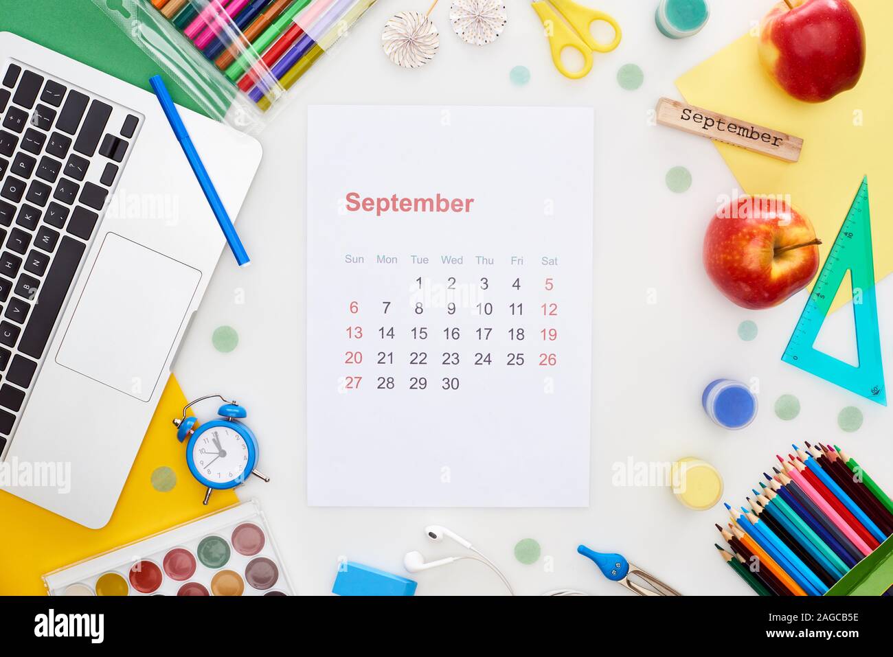 september calendar page, laptop, apples, school supplies, multicolored ...