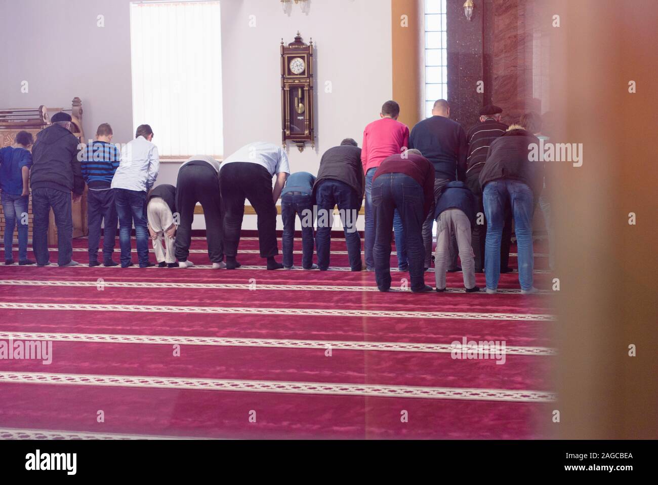 Religious muslim prayers praying together inside the big mosque Stock ...