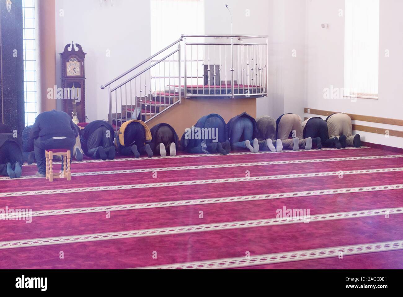 Religious muslim prayers praying together inside the big mosque Stock ...