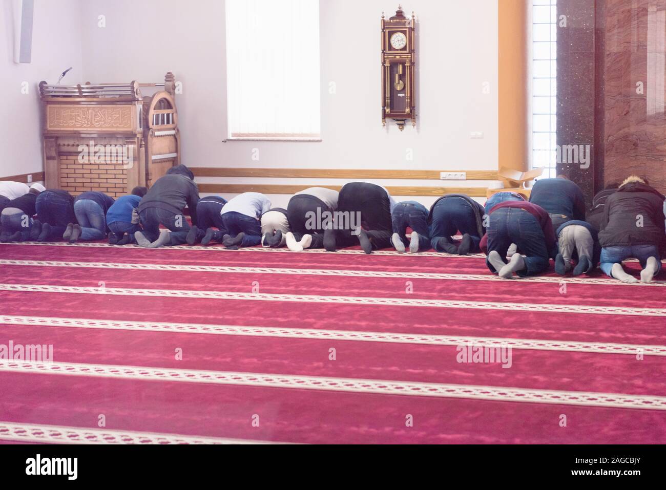 Religious muslim prayers praying together inside the big mosque Stock ...
