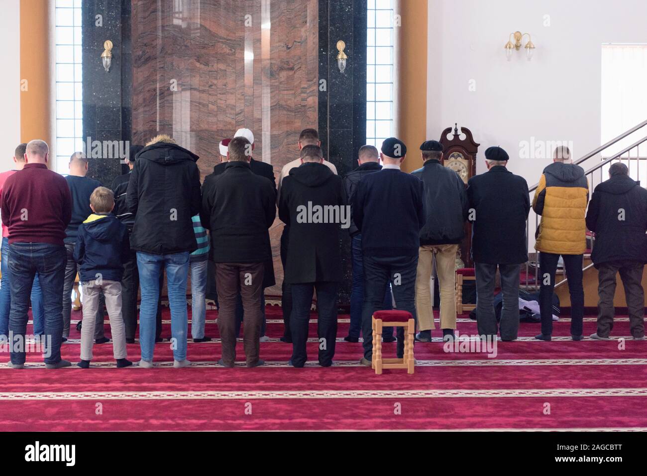 Religious muslim prayers praying together inside the big mosque Stock ...