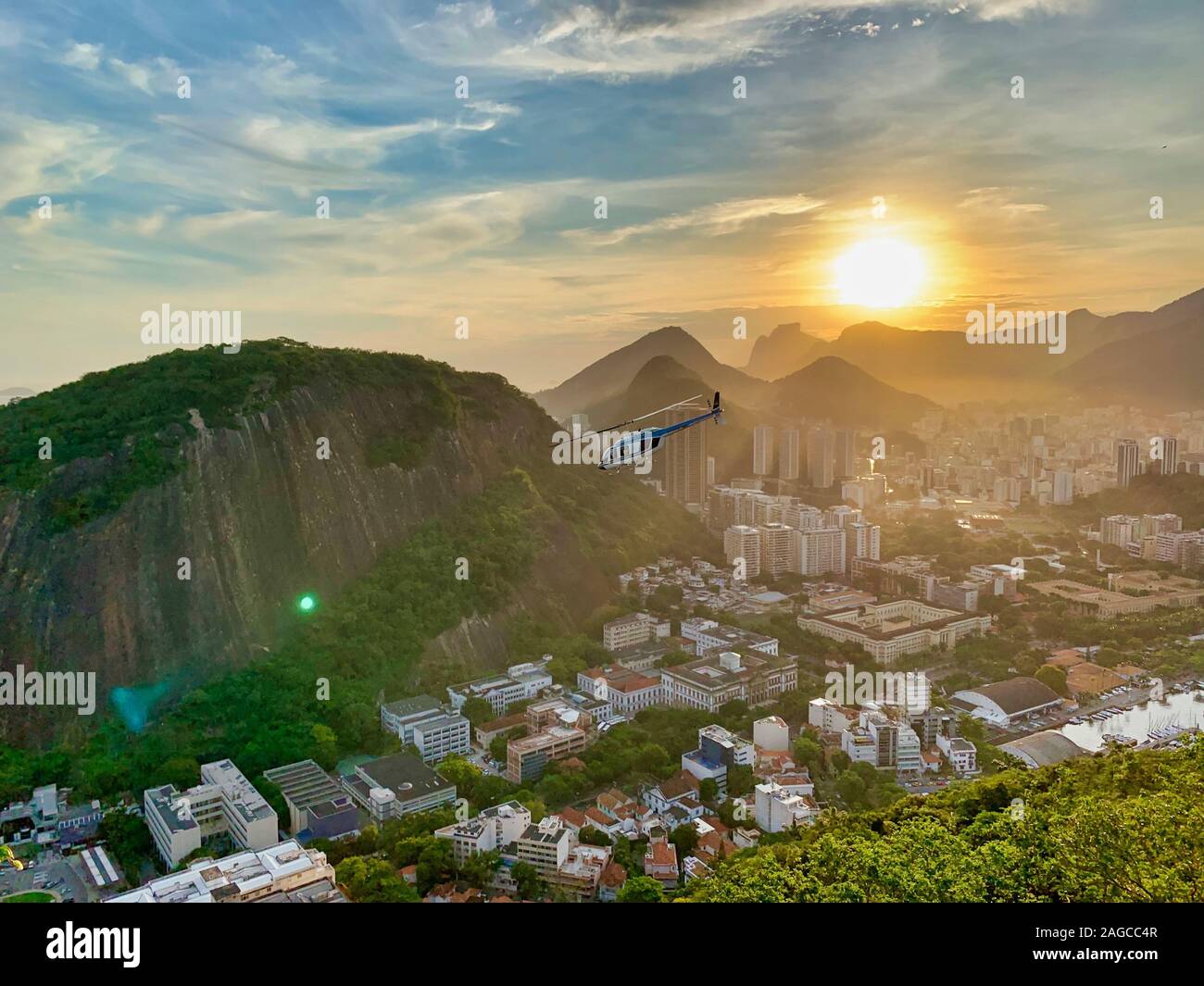 Aerial shot of a helicopter flying over a cityscape in Copacabana Beach ...
