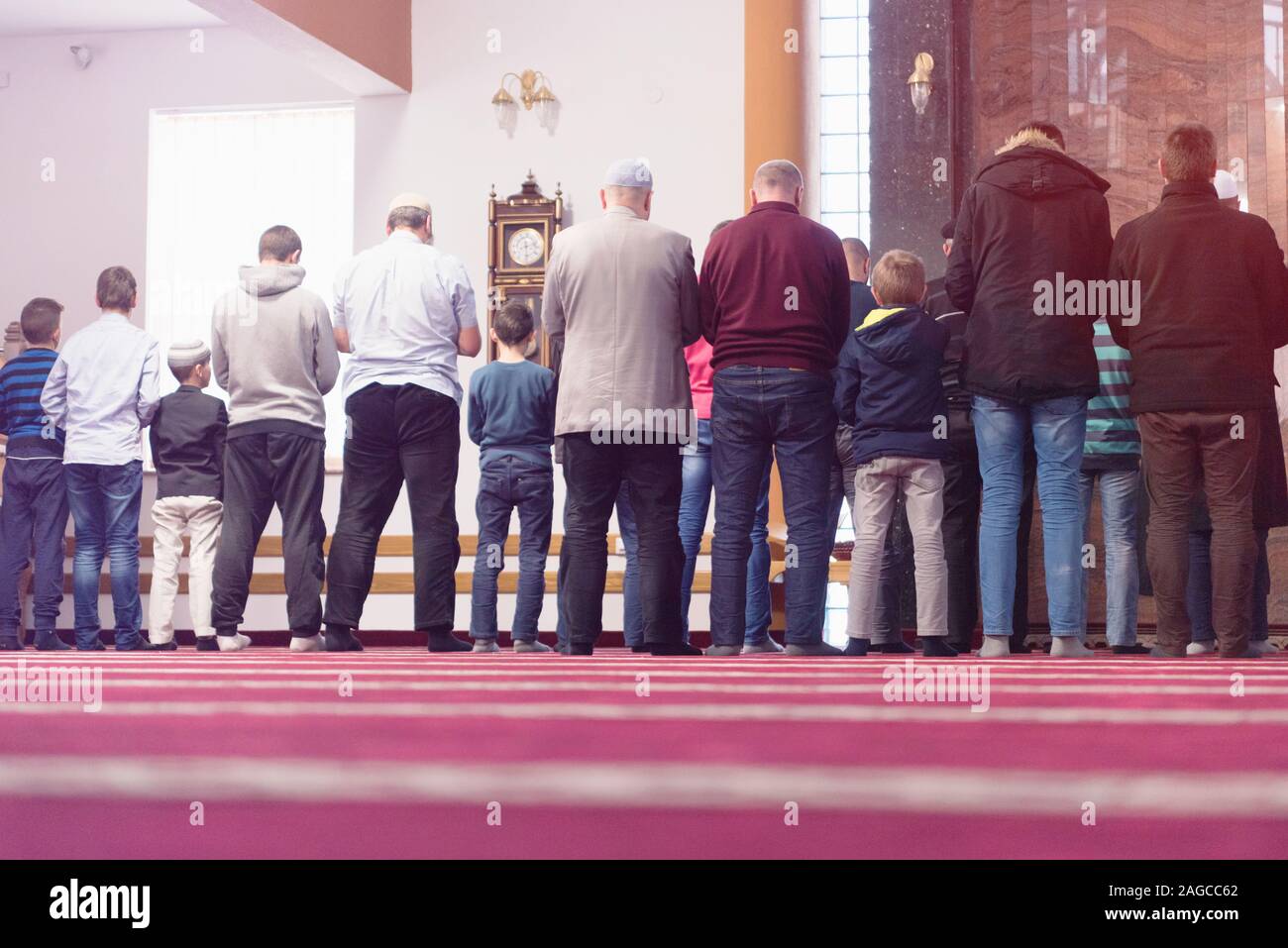 Religious muslim prayers praying together inside the big mosque Stock ...