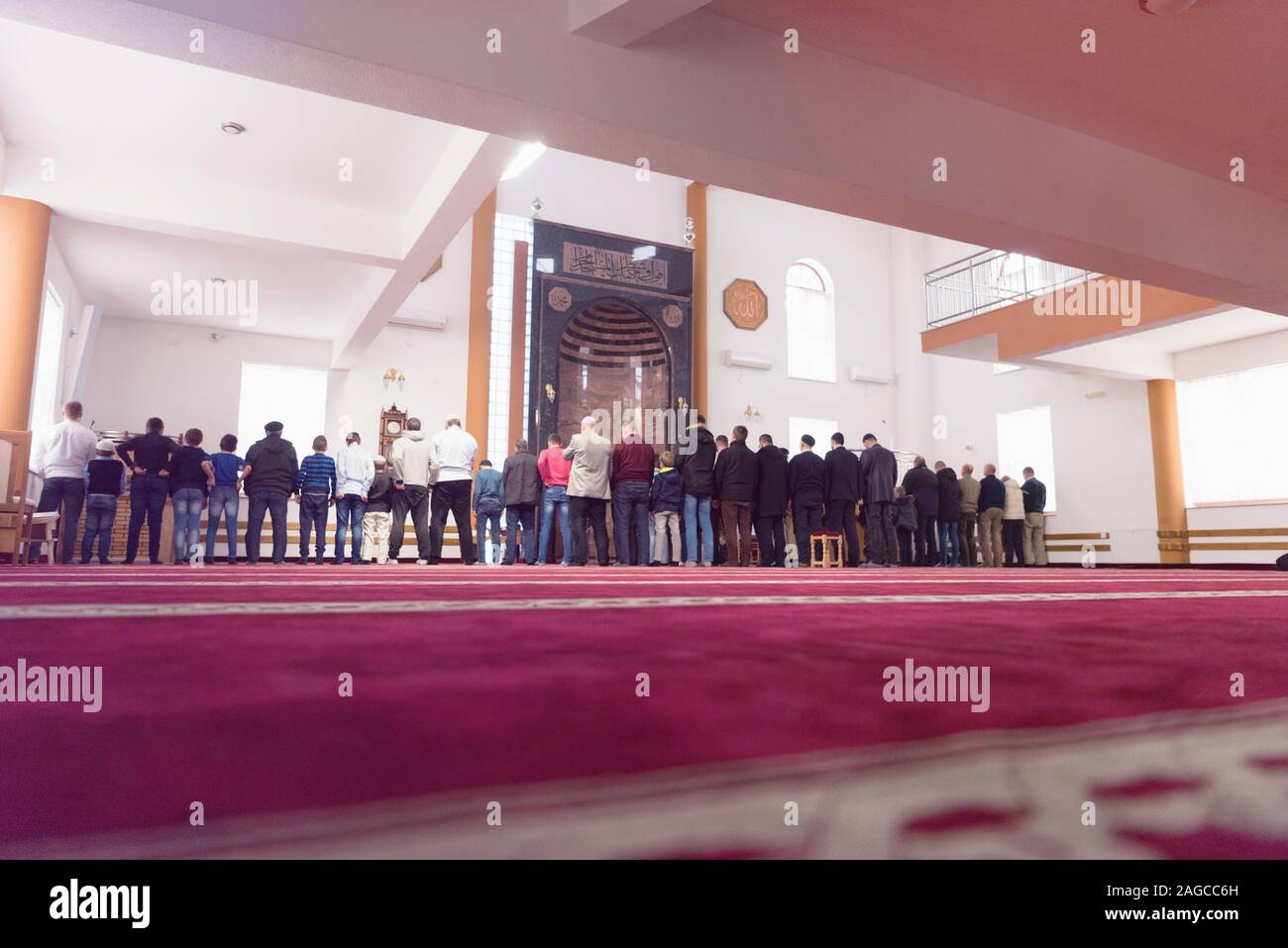 Religious muslim prayers praying together inside the big mosque Stock ...