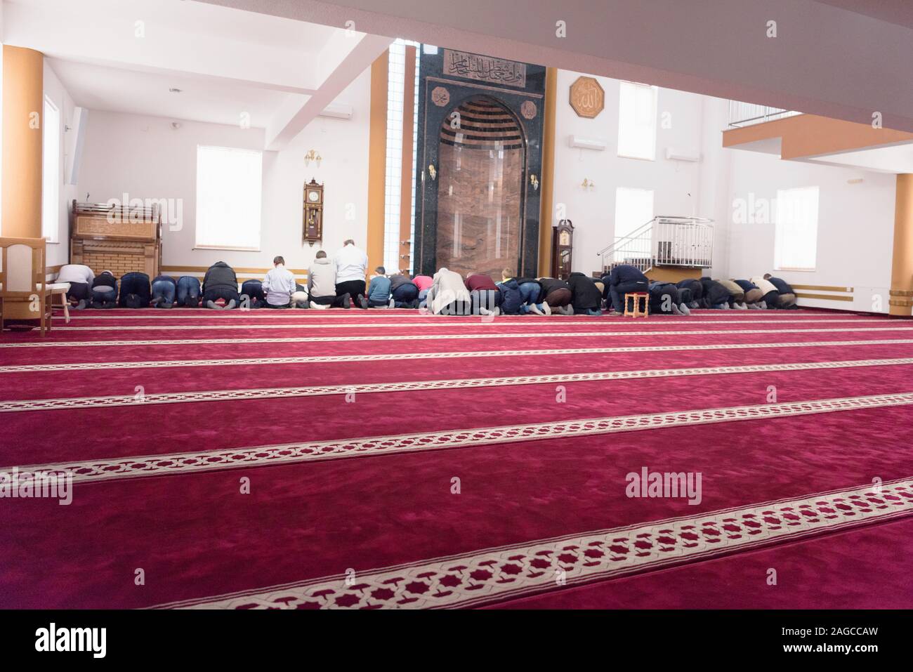 Religious muslim prayers praying together inside the big mosque Stock ...