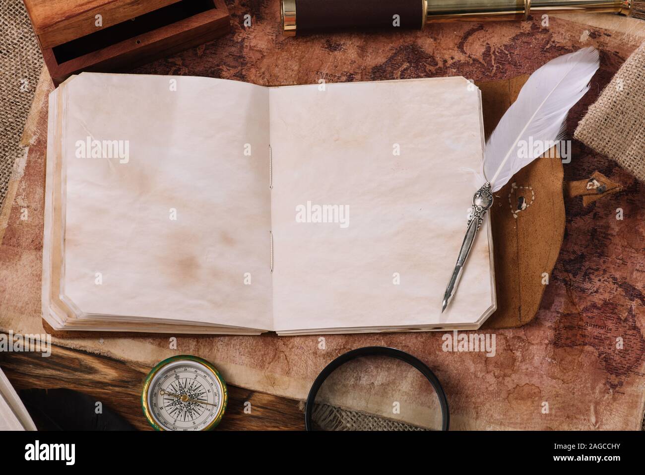 open copy book with blank pages and nib on old world map Stock Photo ...