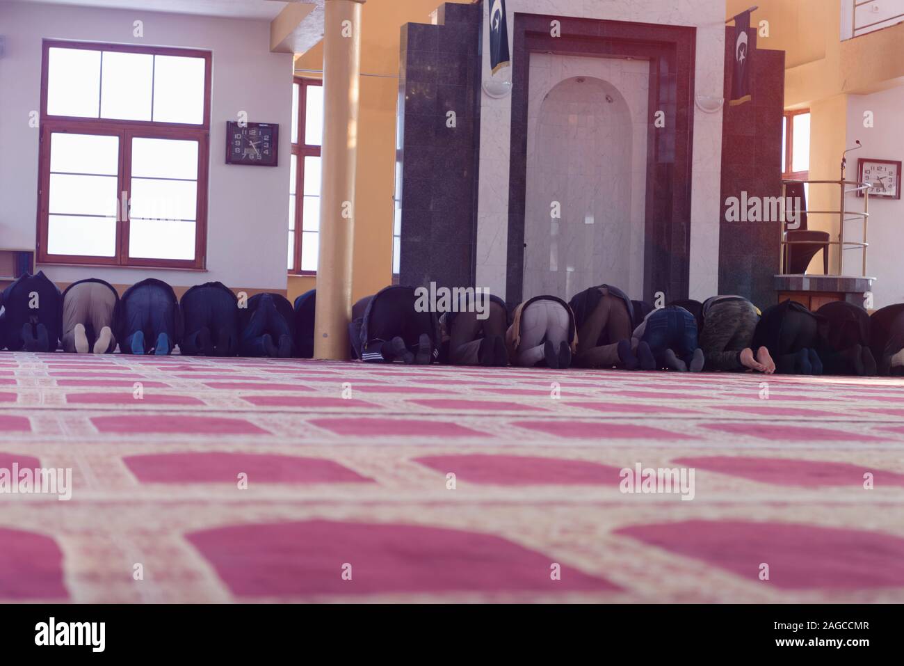 Religious muslim prayers praying together inside the big mosque Stock ...