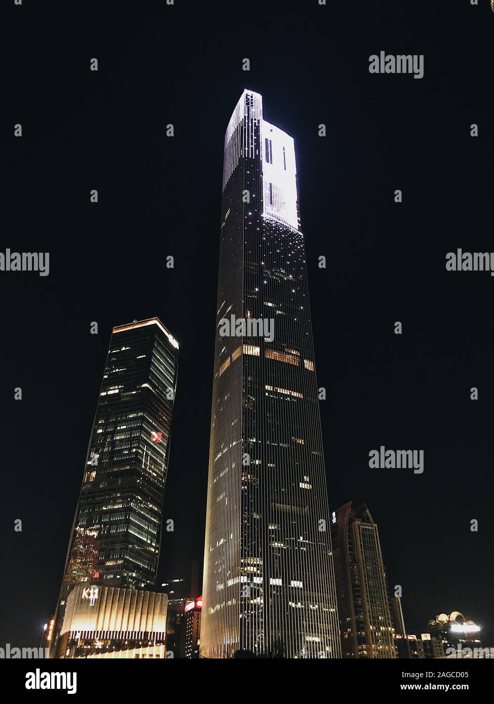 Vertical low angle shot of a city with high rise buildings bursting ...
