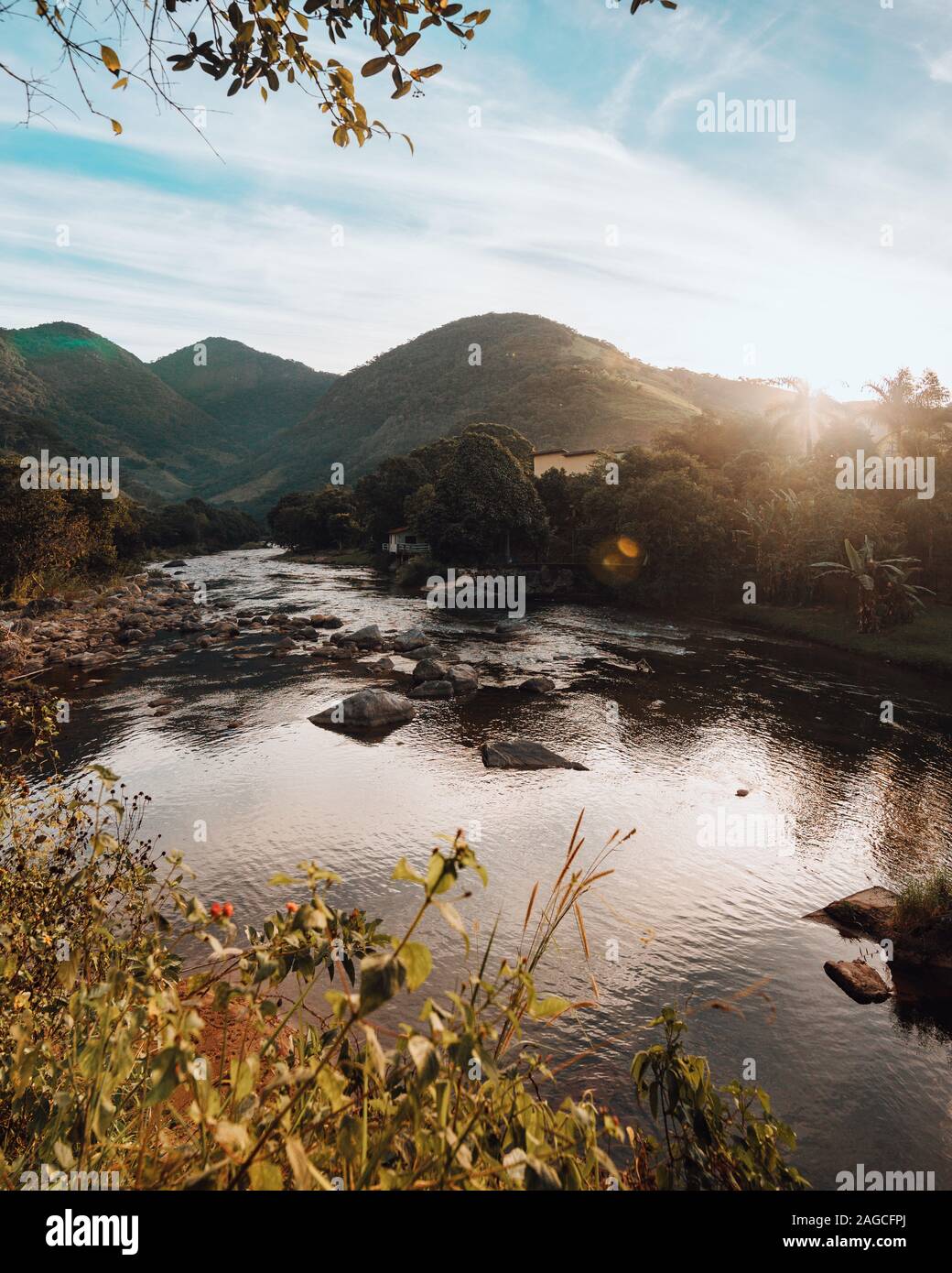 Vertical shot of the hills by the beautiful river captured in Rio De ...