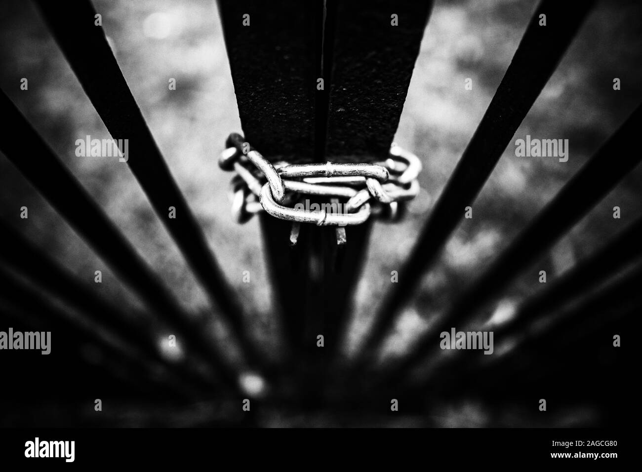 High angle gray scale shot of the metal gate locked with a chain Stock ...