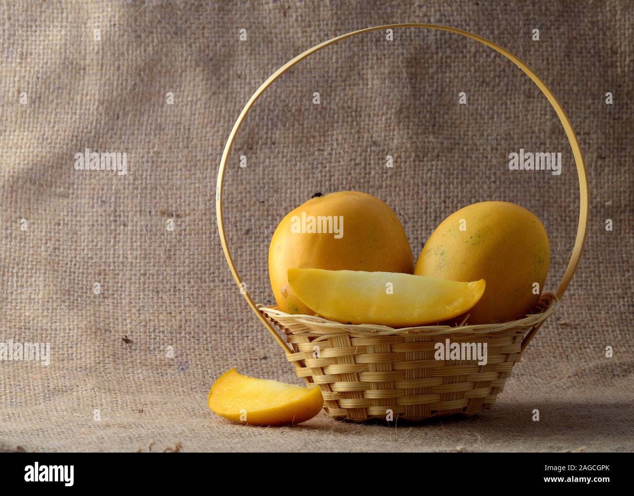 Mango in bamboo basket hi-res stock photography and images - Alamy