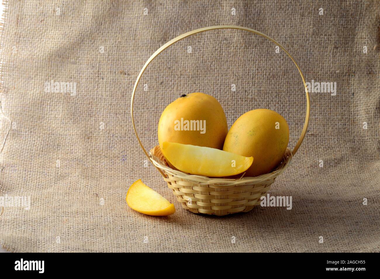 Mango in bamboo basket hi-res stock photography and images - Alamy