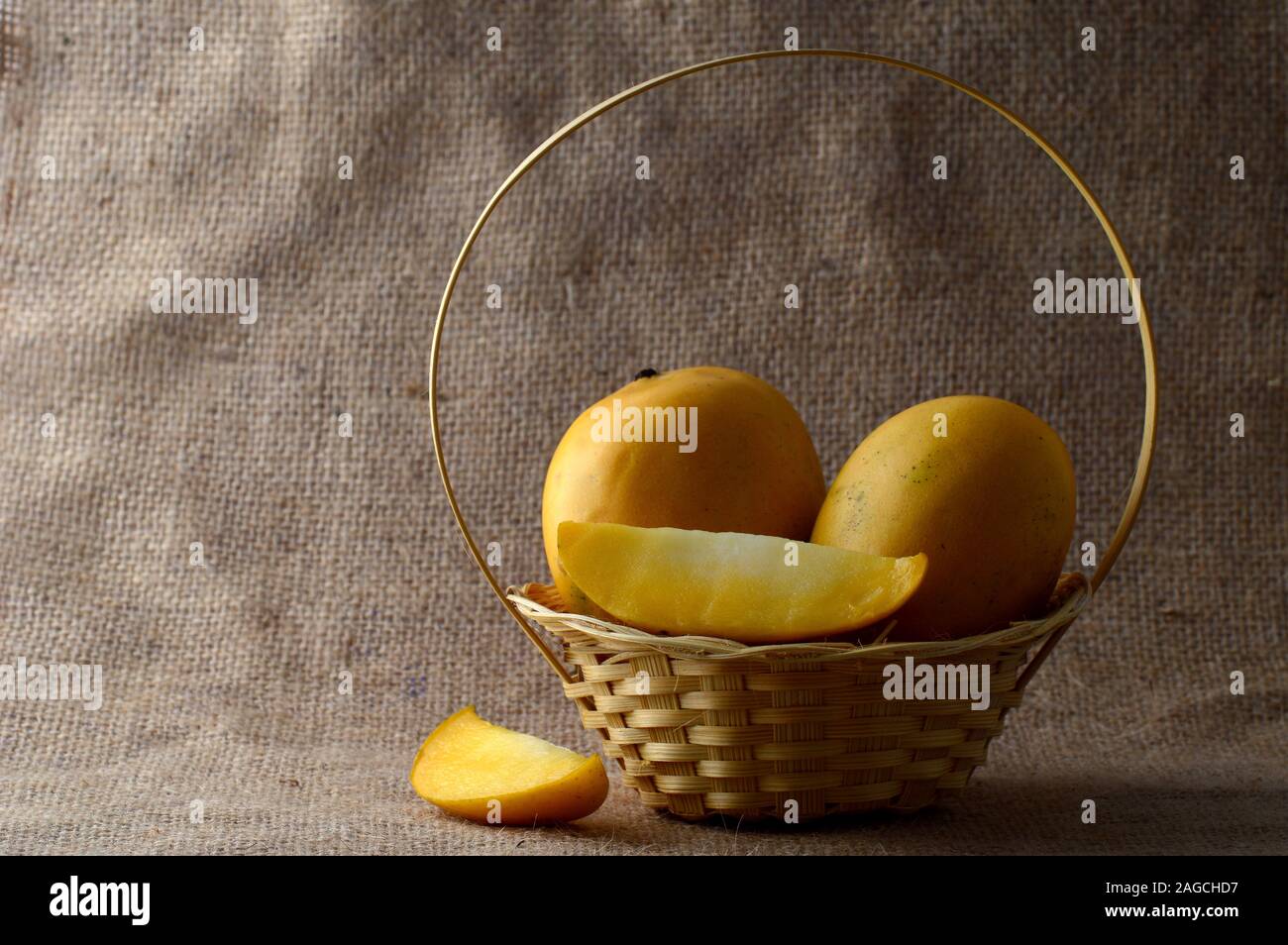 Mango in bamboo basket hi-res stock photography and images - Alamy