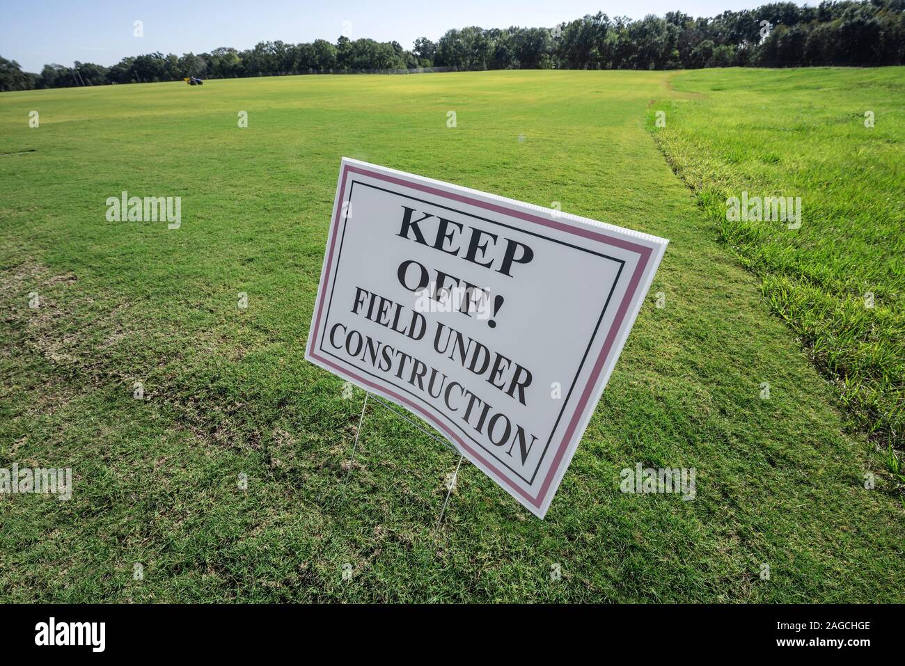 Warning sign to keep off. to prevent damaging a grass field that's ...