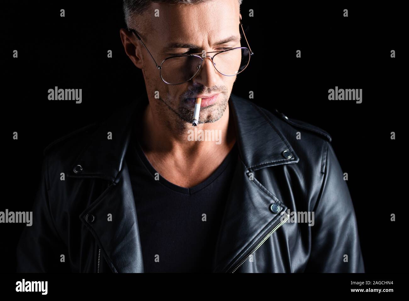 Handsome man smoking cigarette hi-res stock photography and images - Alamy